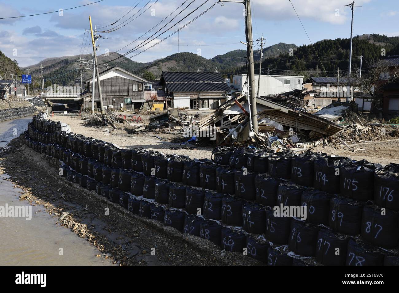 Photo taken on Jan. 1, 2025, shows a collapsed building in Wajima ...