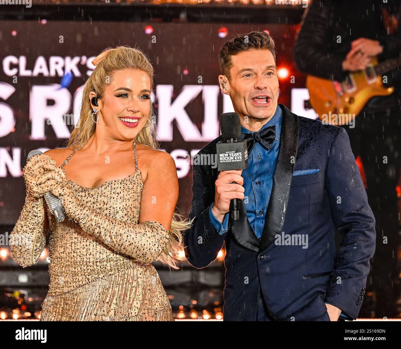 New York, USA. 31st Dec, 2024. Megan Moroney and Ryan Seacrest attend ...