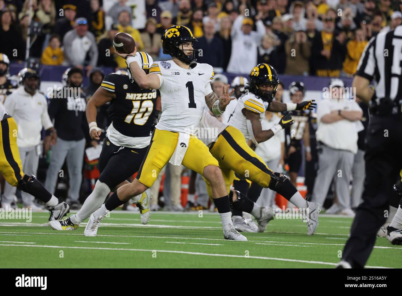 NASHVILLE, TN - DECEMBER 30: Brendan Sullivan (1) of Iowa takes a pass ...