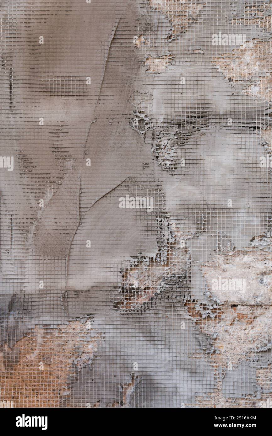 Mesh for cementing, attached to a rough cement wall Stock Photo - Alamy