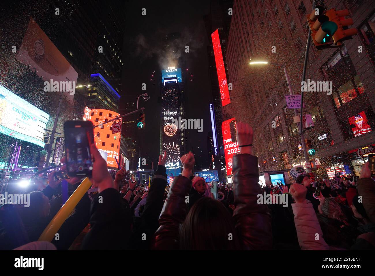 The confetti descend from the skies after counting down. The 2025 New ...