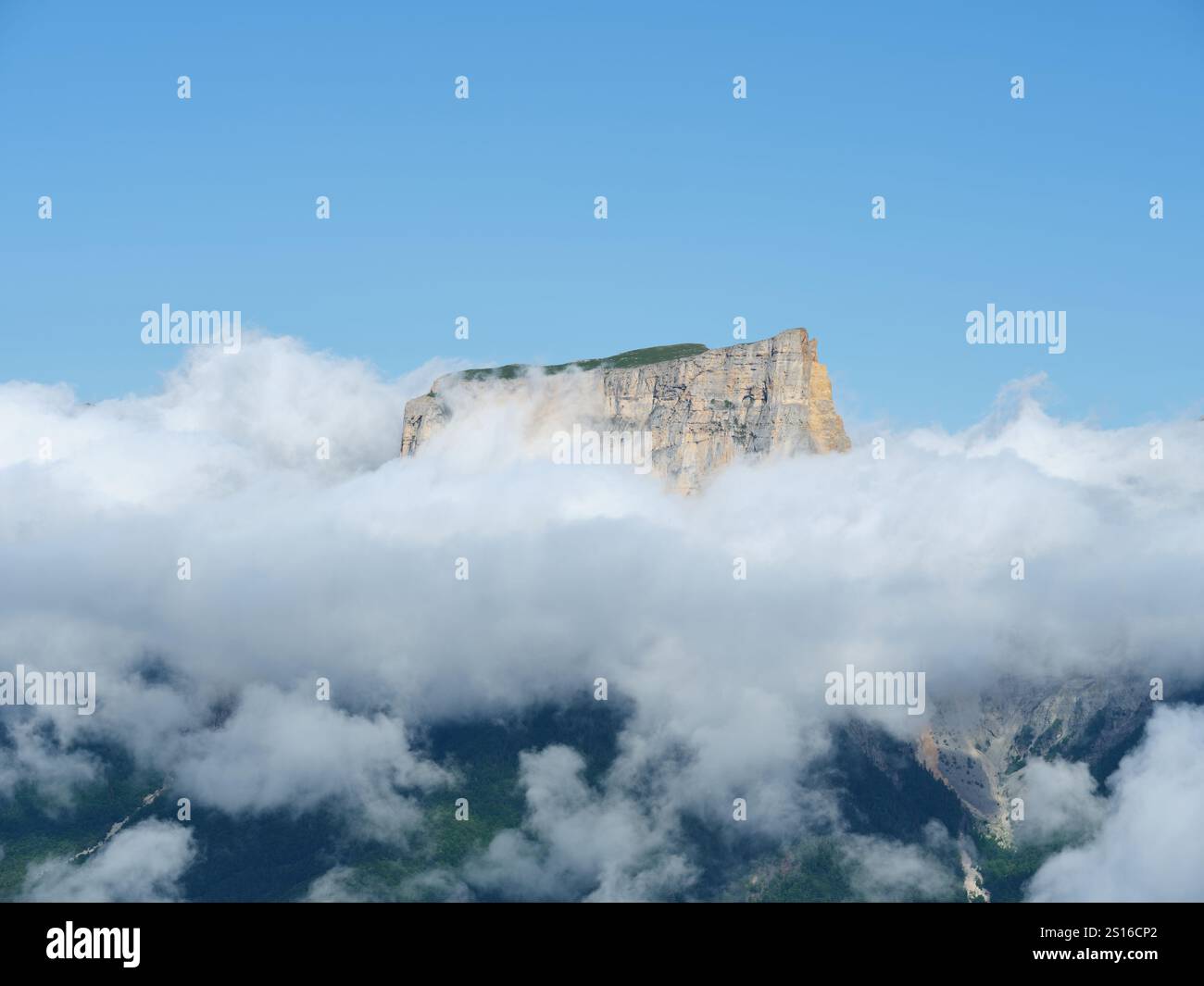 AERIAL VIEW. Mont Aiguille, an isolated limestone butte emerging from a ...