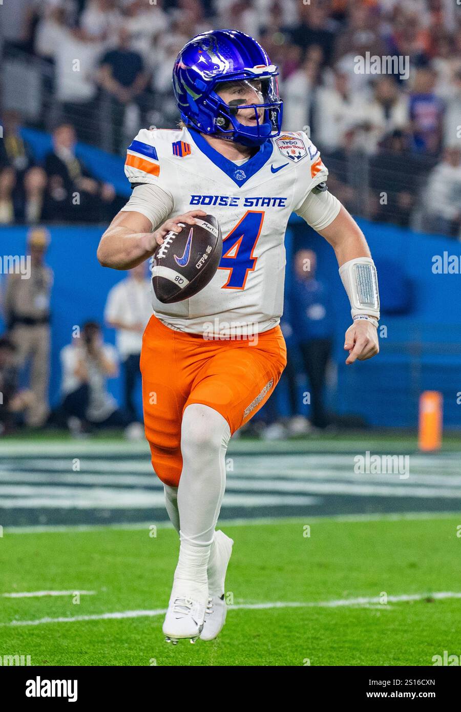 December 31 2024 Glendale, AZ U.S.A. Boise State quarterback Maddux Madsen (4)looks for the deep ...
