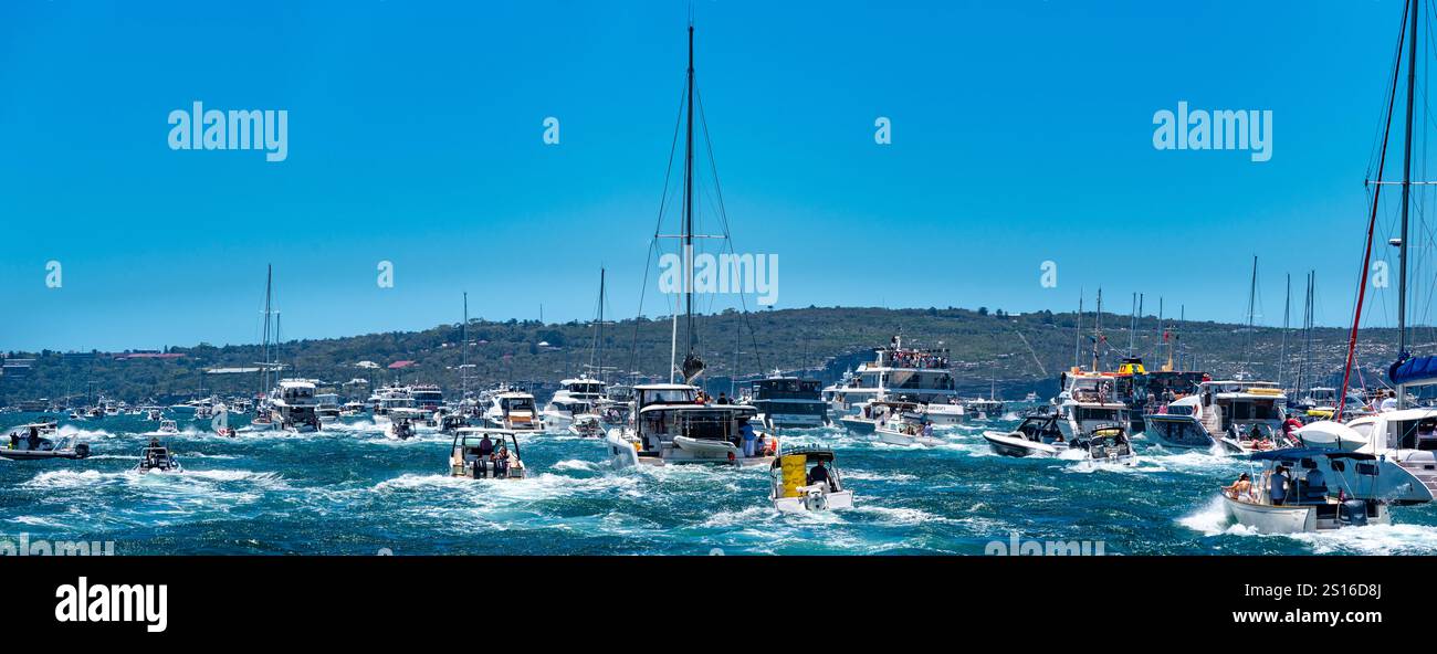 A large flotilla of spectator craft follow the leaders towards the open ...