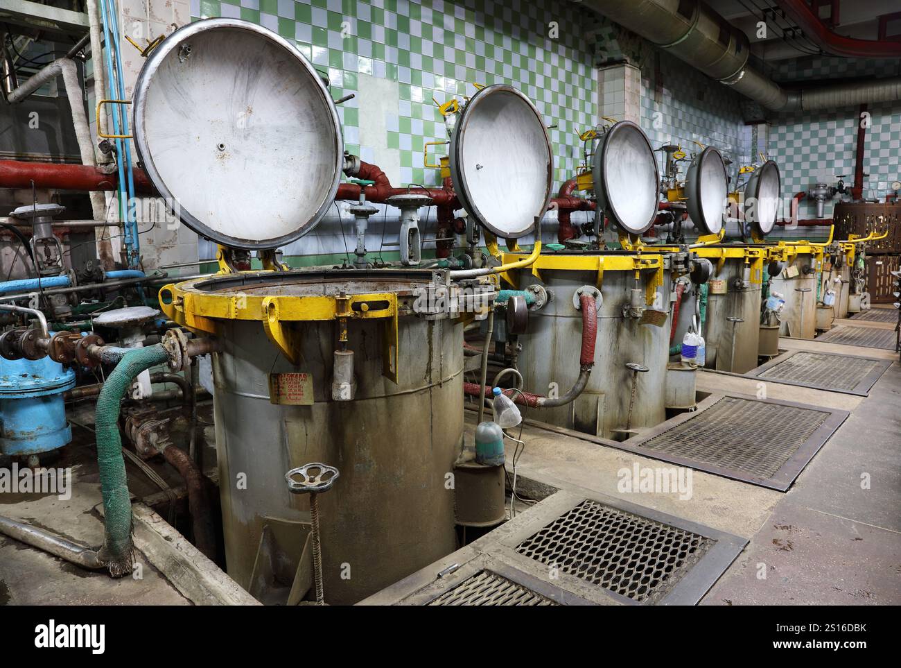 Tanks for sterilization of canned fish at the cannery Stock Photo - Alamy