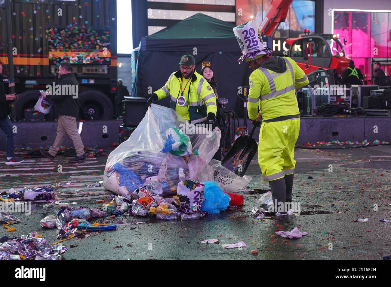 Workers of the City of New York's Department of Sanitation (DSNY) clean ...
