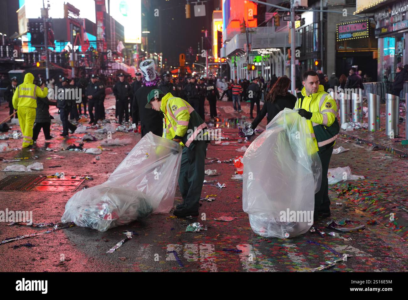 Workers of the City of New York's Department of Sanitation (DSNY) clean ...