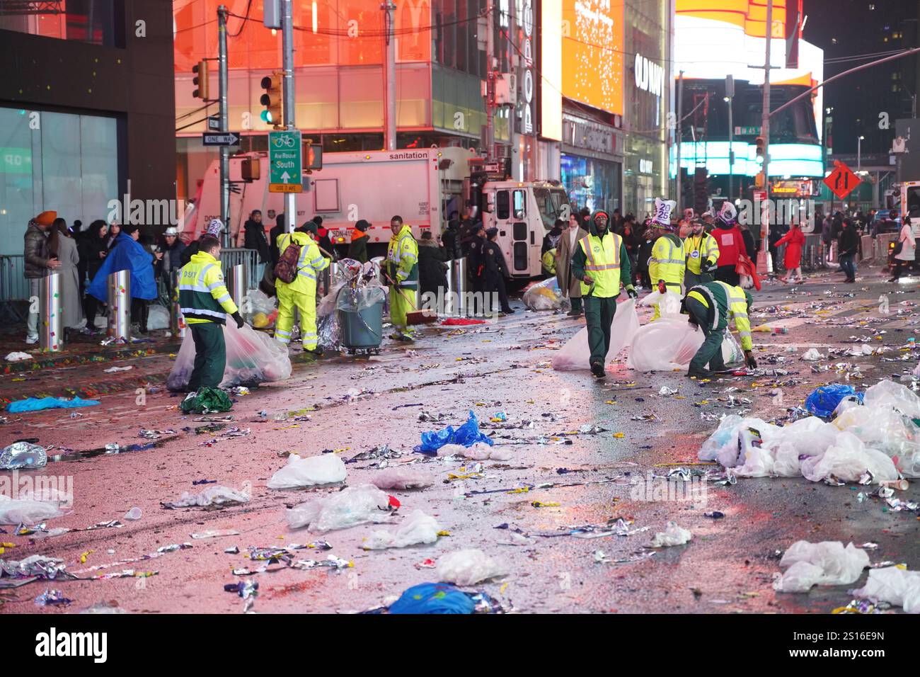 Workers of the City of New York's Department of Sanitation (DSNY) clean ...