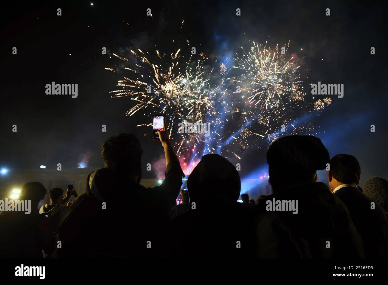 Karachi, Pakistan. 1st Jan, 2025. People watch fireworks in celebration ...