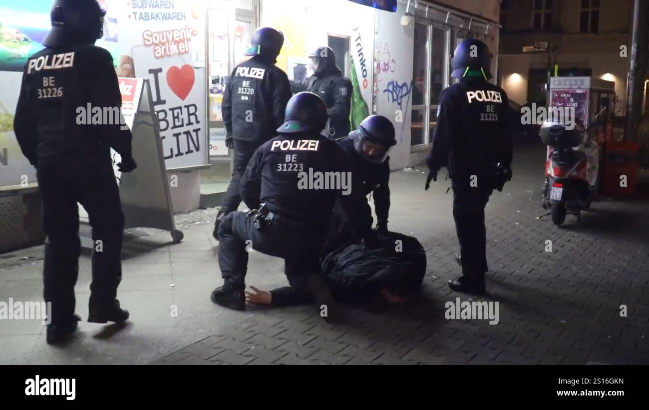 Berlin, Germany. 01st Jan, 2025. Police officers arrest a person on New ...