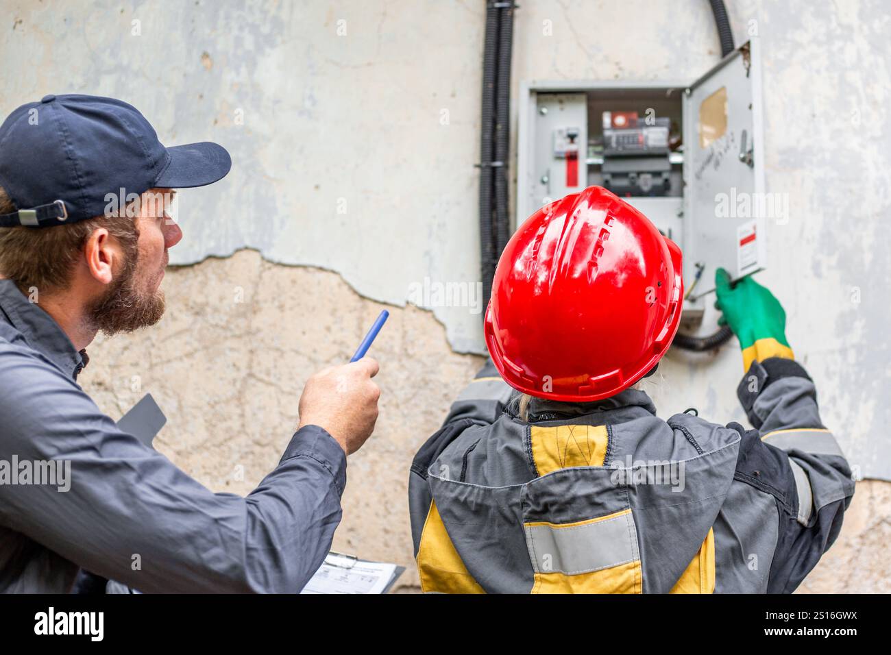 Workers check the operation of the electricity meter, check the ...