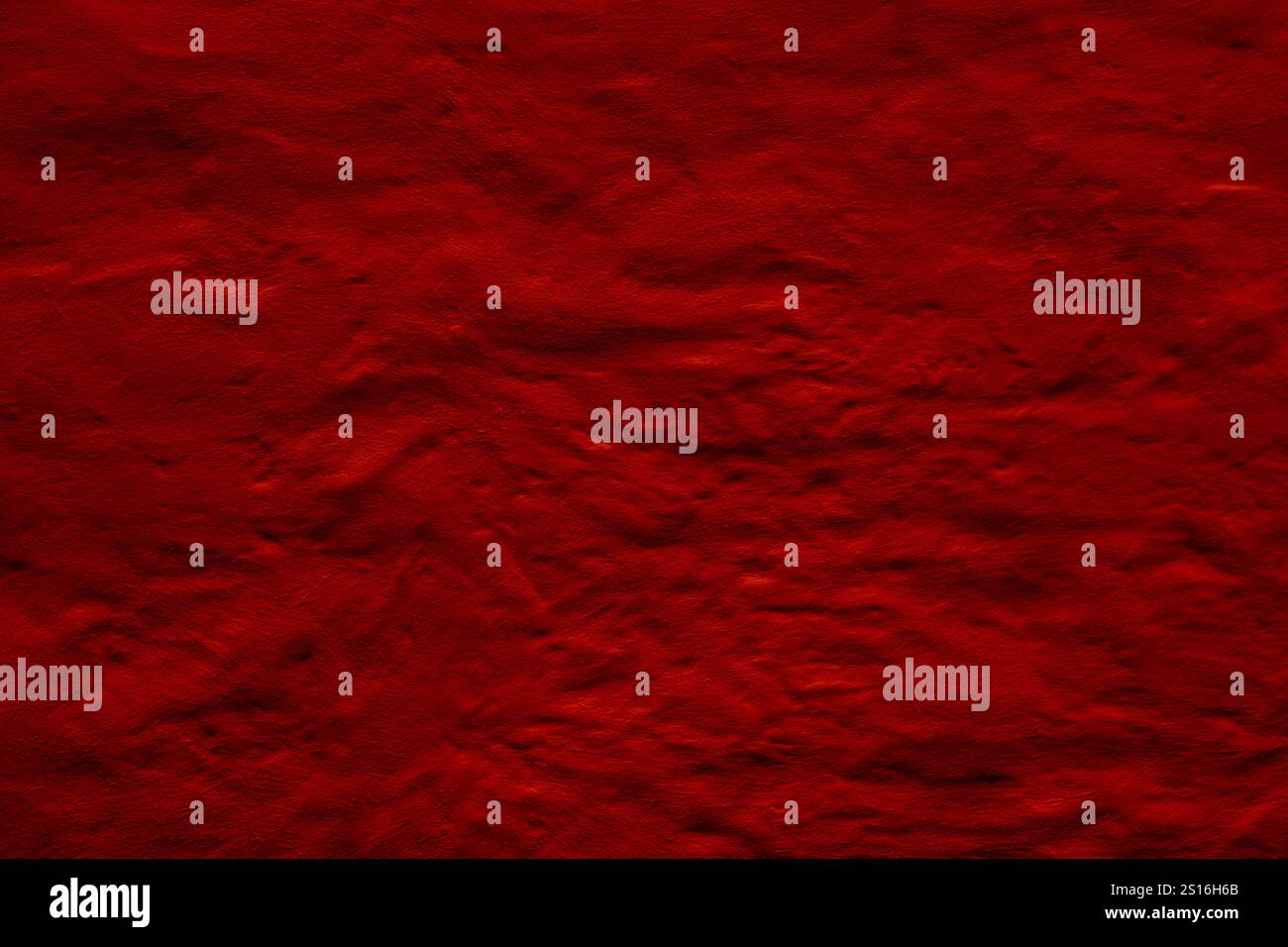 Rustic textured wall with a deep red color, suitable for creative ...