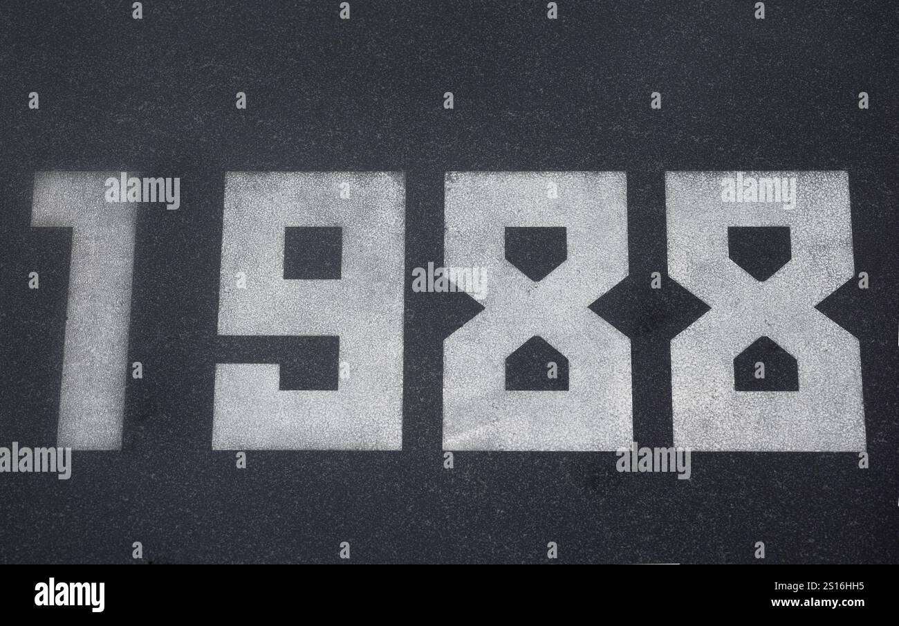 Black granite slab with white numbers 1988 on it Stock Photo - Alamy