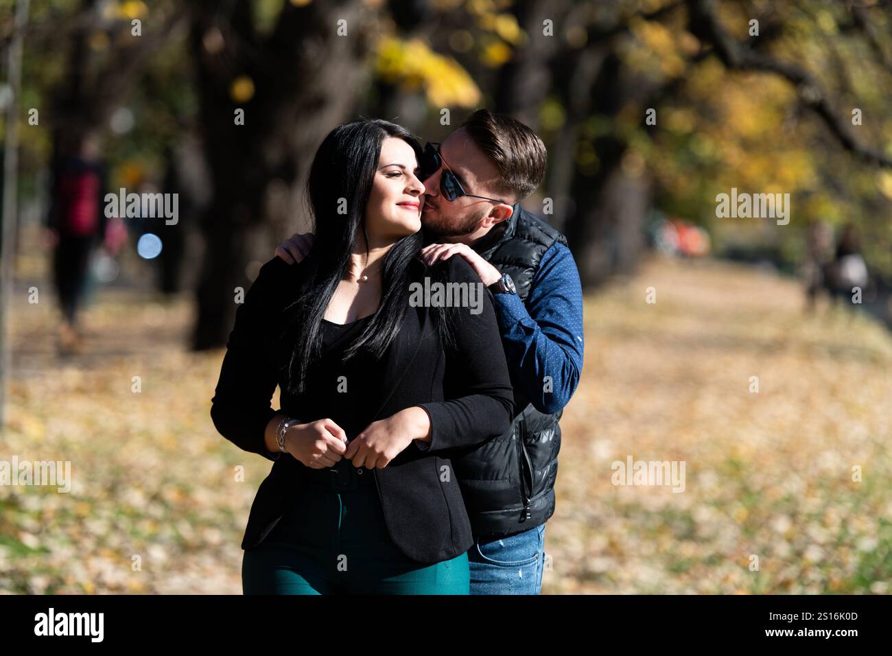 Beautiful Autumn Day With Couple Sharing A Tender Hug And Kiss Stock Photo - Alamy