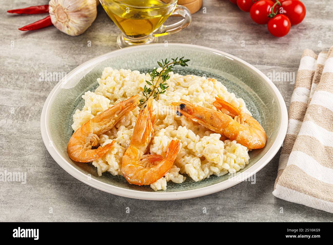 Italian cuisine - risotto with prawn served thyme Stock Photo - Alamy