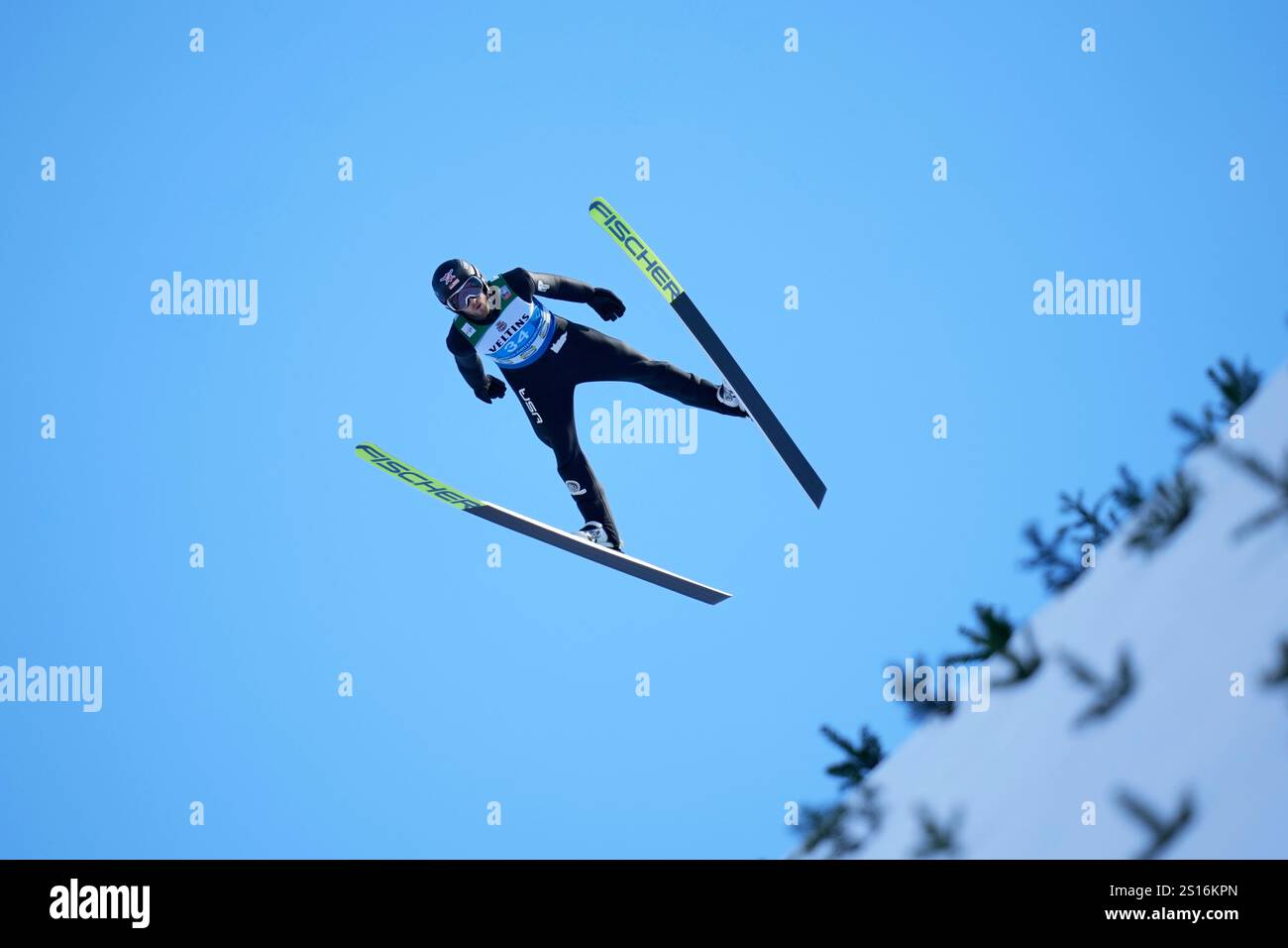 Kevin Bickner, of the United States, soars through the air during his ...