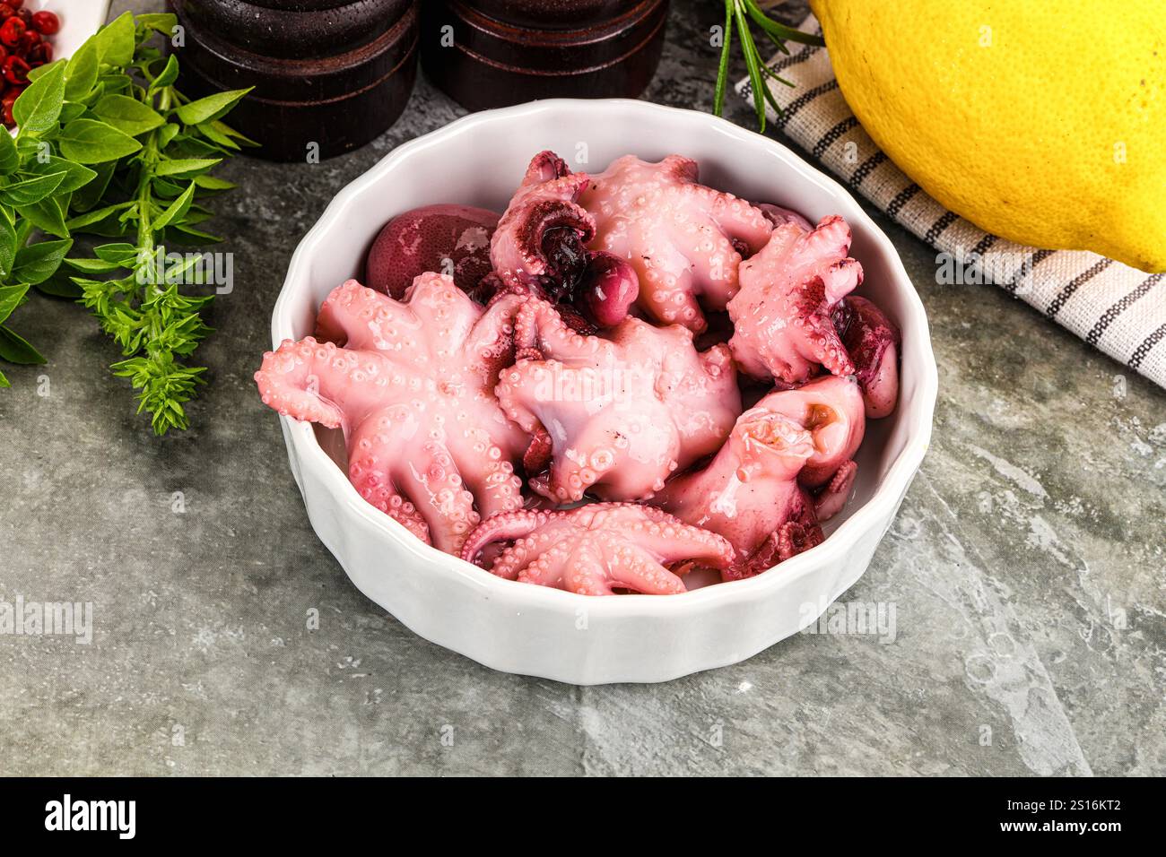 Marinated baby octopus snack appetizer served lemon Stock Photo - Alamy