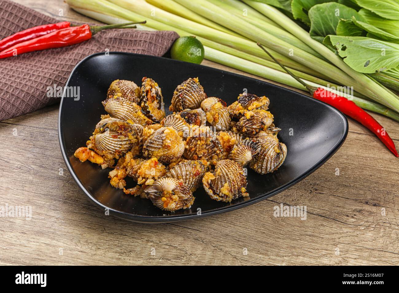 Blood Cockle Fried With Garlic and spices Stock Photo - Alamy