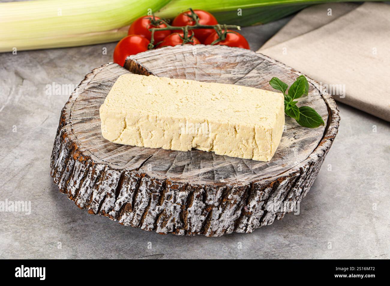 Soya vegan tofu cheese brick over board Stock Photo - Alamy