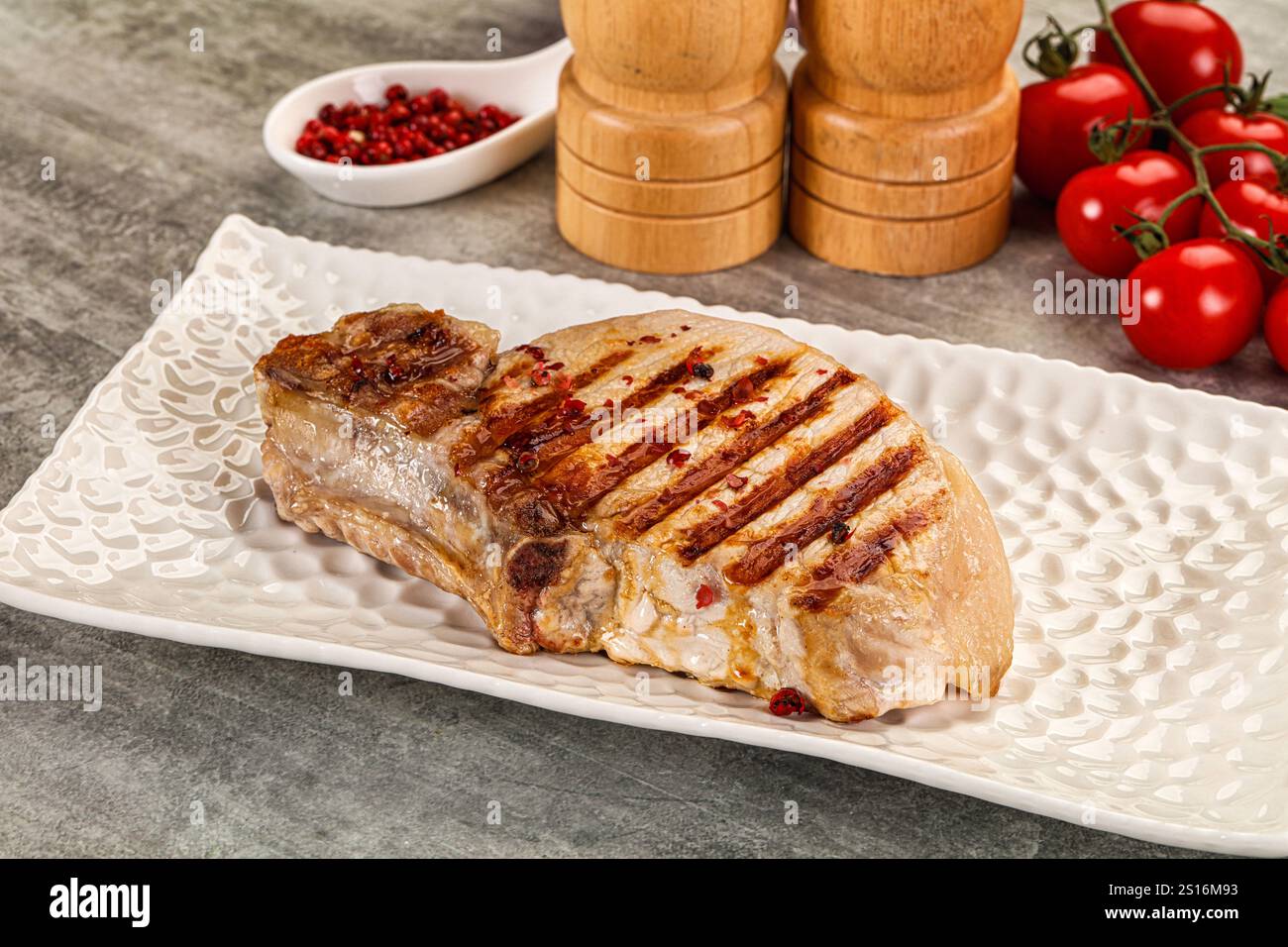 Grilled fat pork loin steak with bone Stock Photo - Alamy