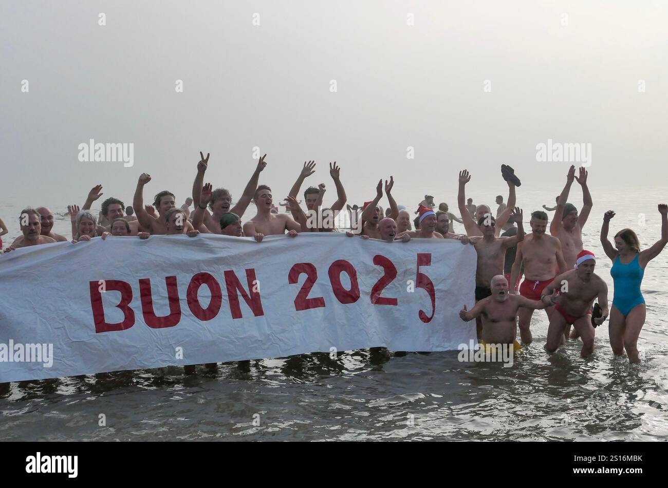VENICE ITALY Swimmers of the Ibernisti walk towards the sea for a dip ...