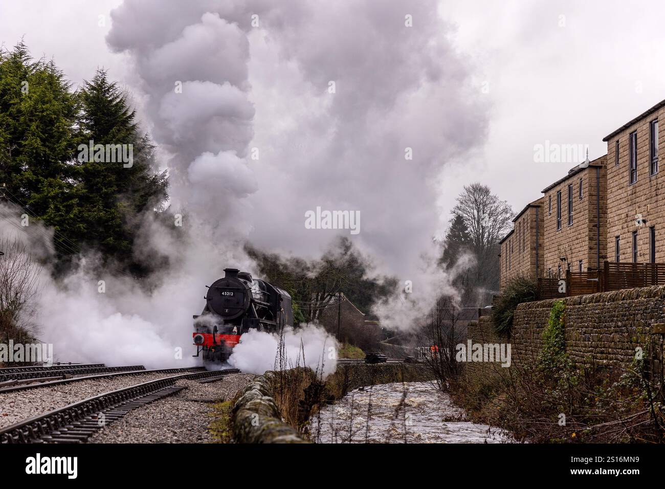 Haworth, UK. 01st Jan, 2025. LMS Black 5 45212 leaves Haworth MPD as it ...