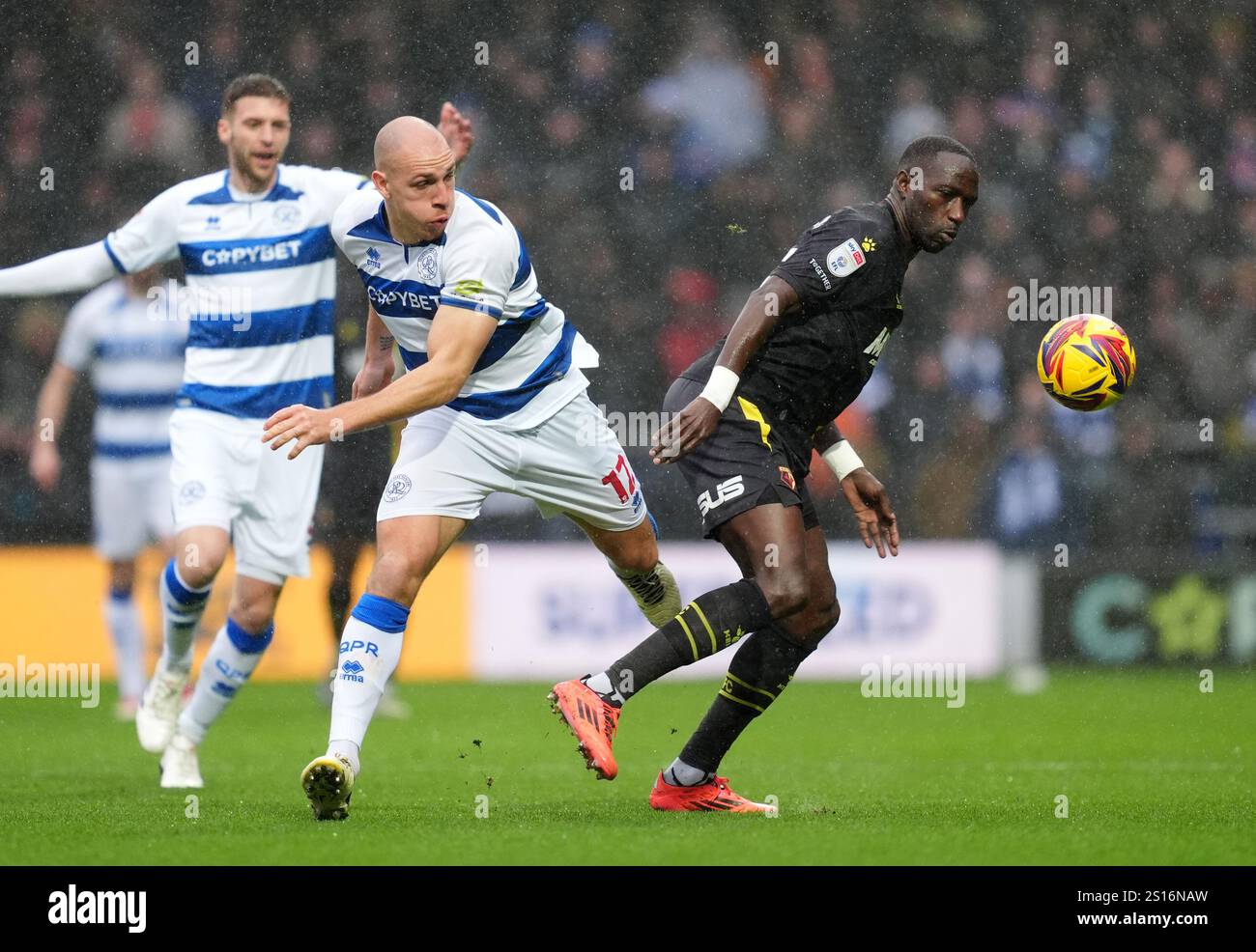 Queens Park Rangers' Michael Frey (left) and Watford's Moussa Sissoko ...