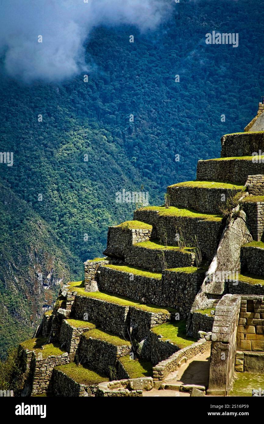 The steep terraces built into the mountainside of Machu Picchu, Peru ...
