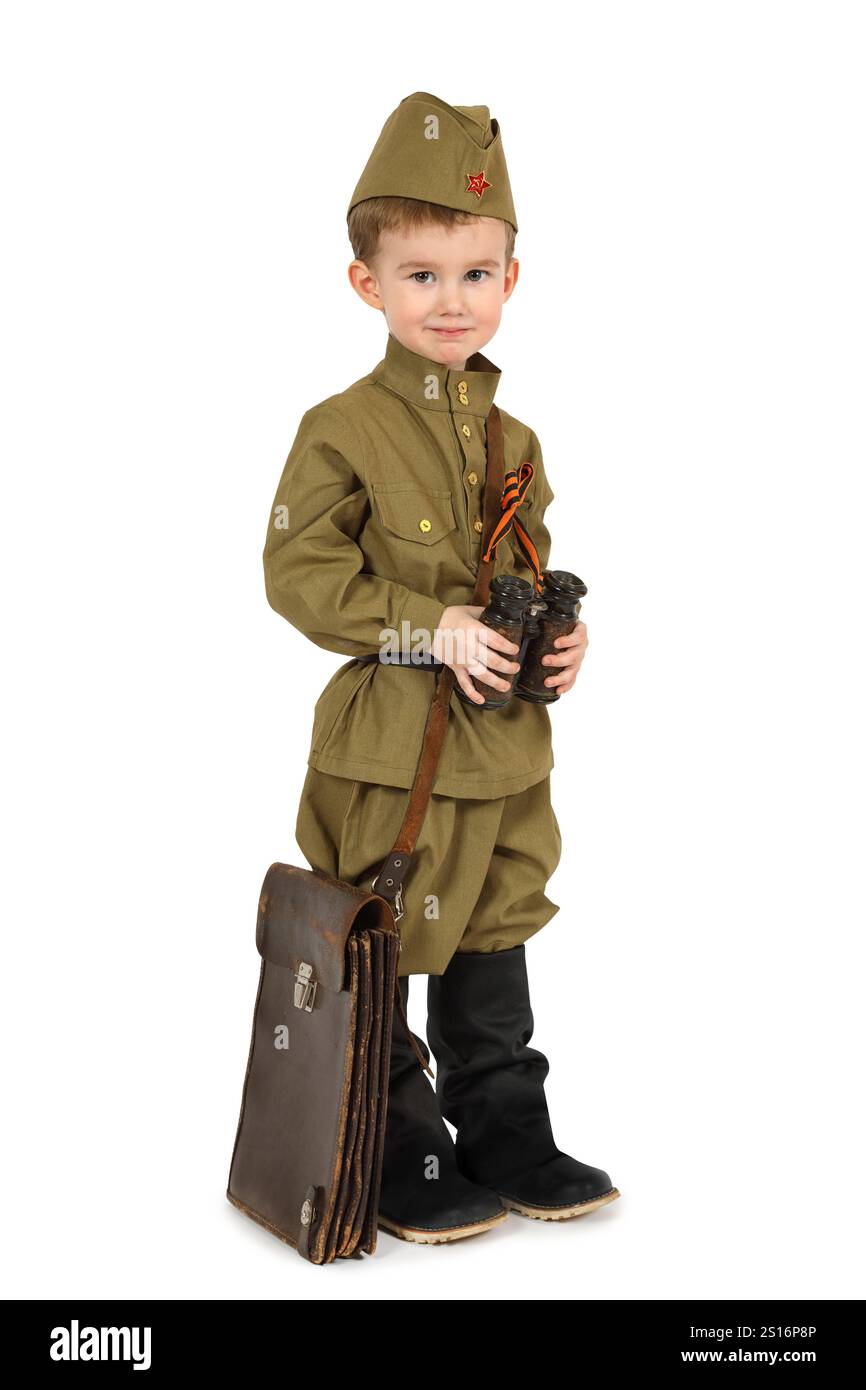 The little boy in the old-fashioned Soviet military uniform with a binoculars isolated on white ...