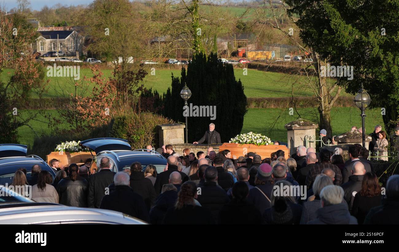 The coffins of father and son Peter and Loughlin Devlin, who were ...