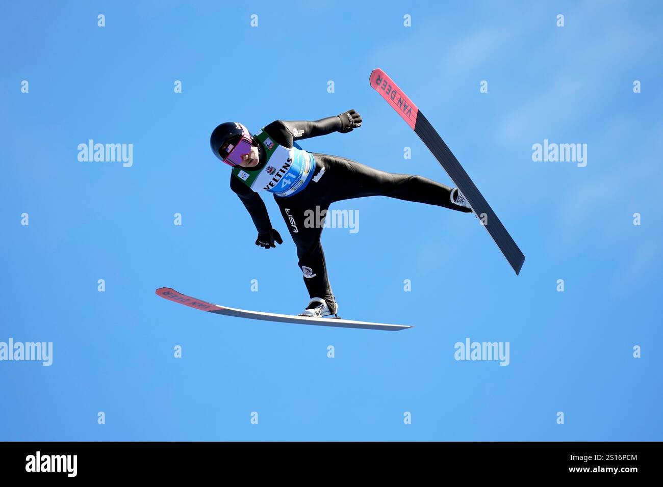 Casey Larson, of the United States, soars through the air during his ...
