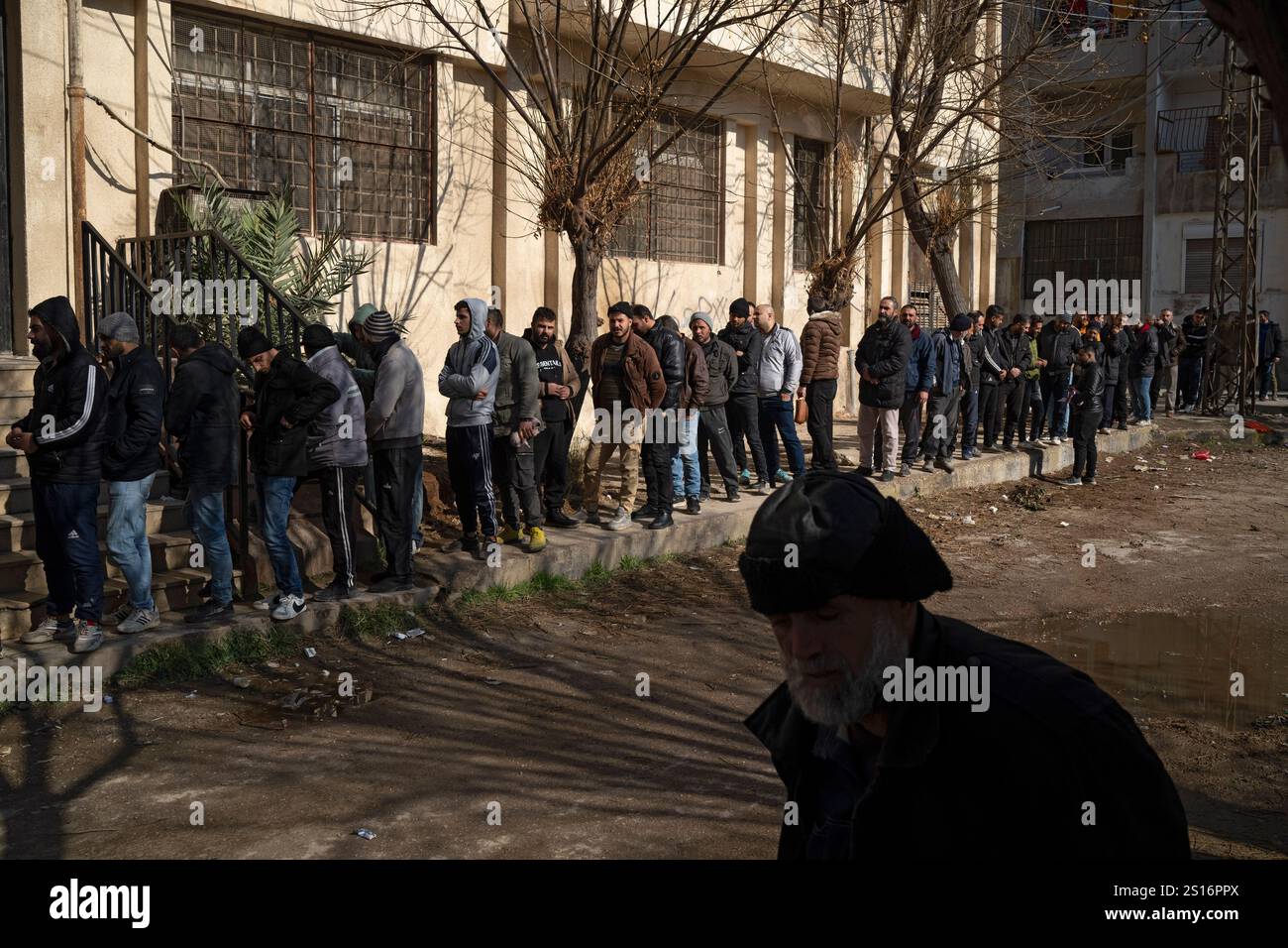 Members of ousted Syrian President Bashar Assad's army, line up to ...