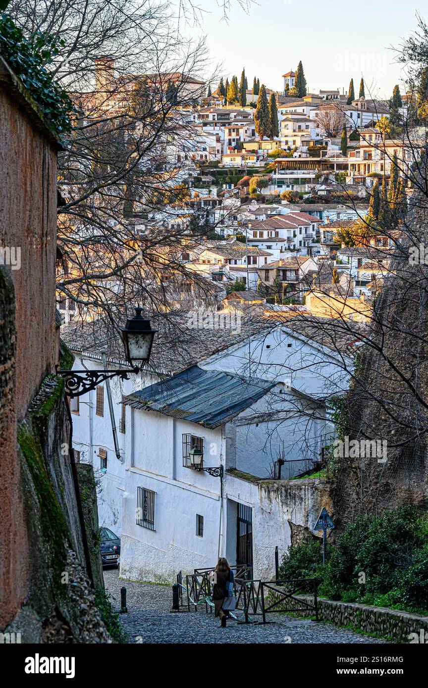A person walking at the city entrance, with the final sections of the ...