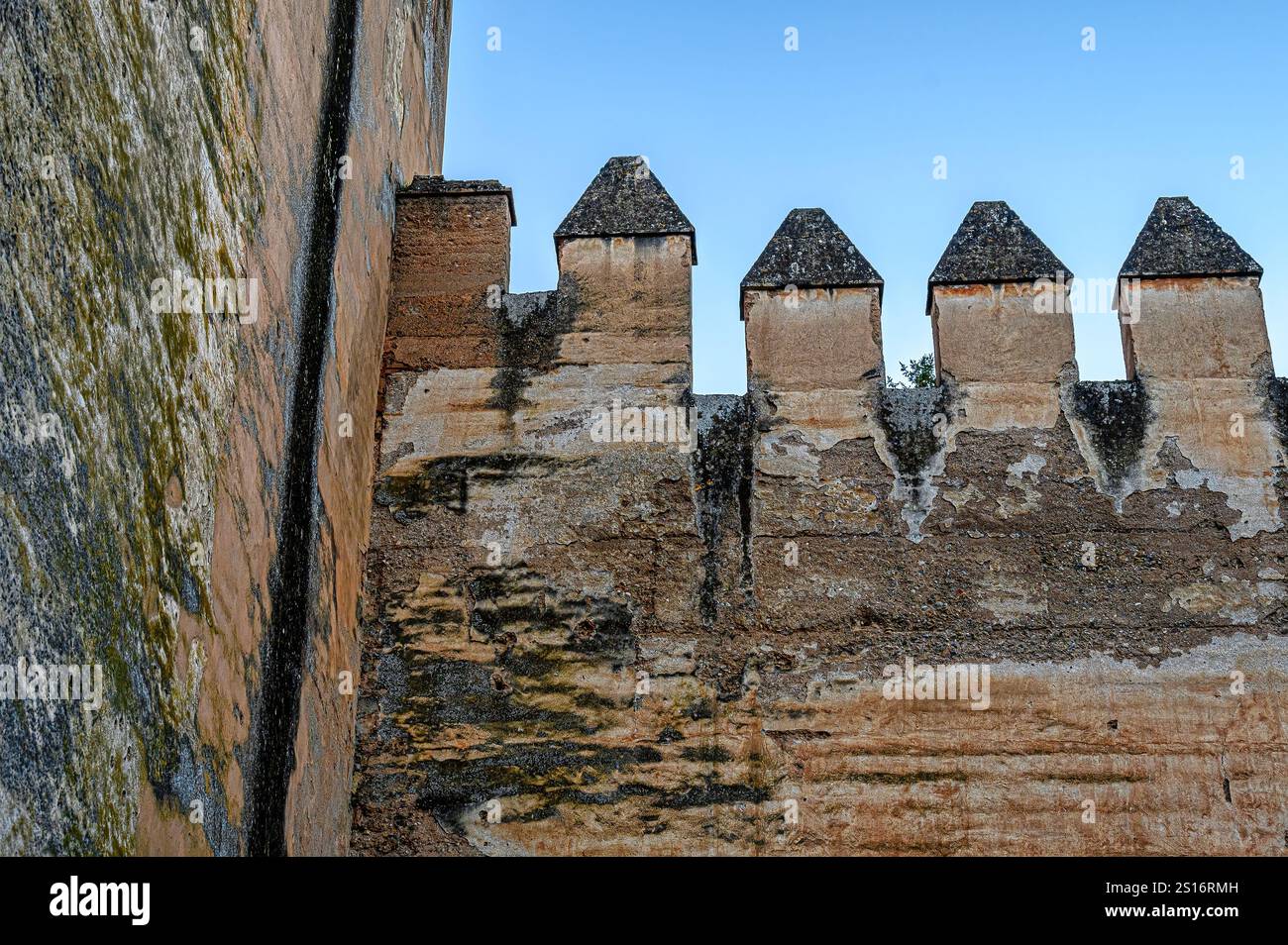 Ancient merlons atop a medieval fortified wall, part of the exterior ...