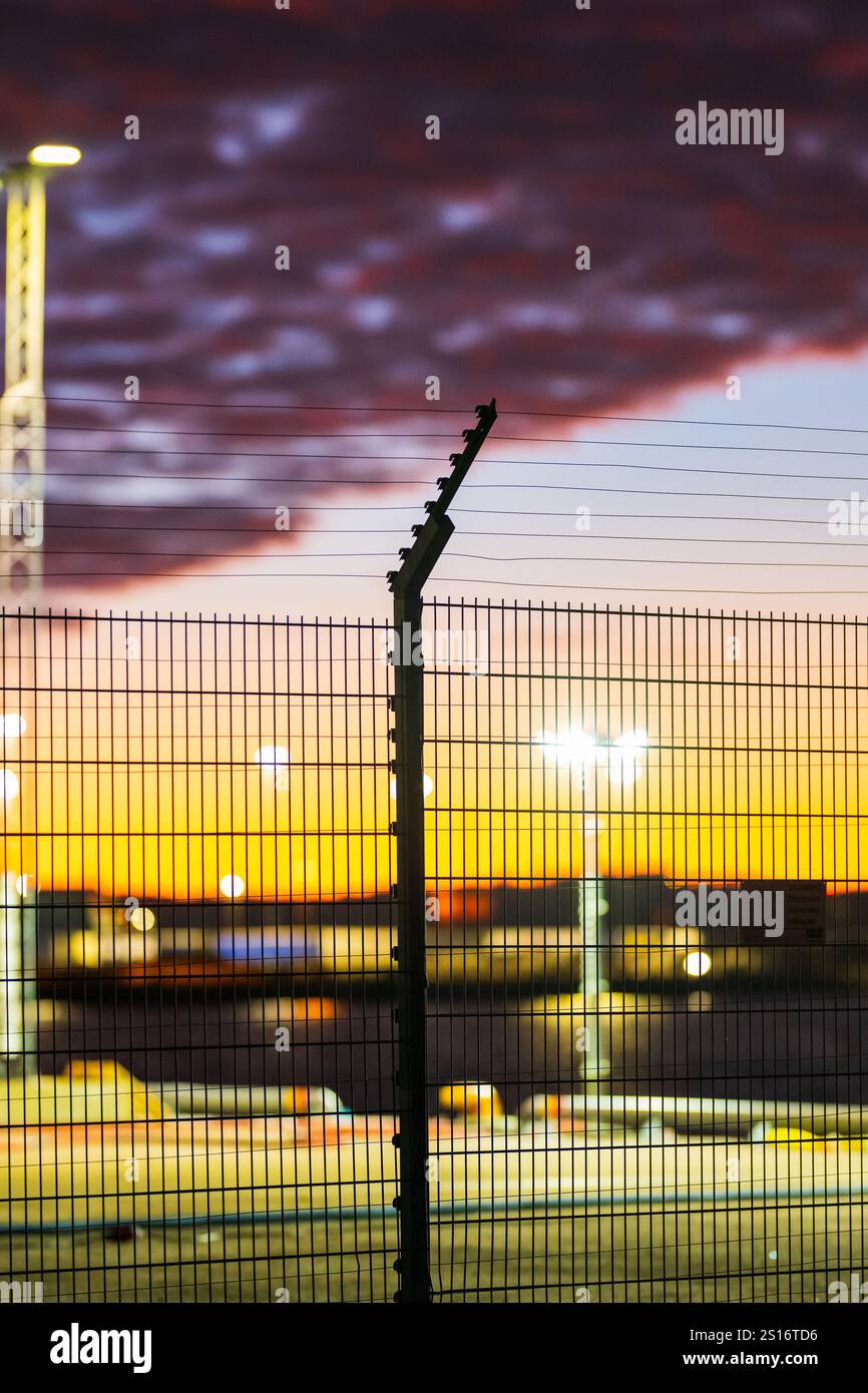 Fence of a high security port Stock Photo - Alamy
