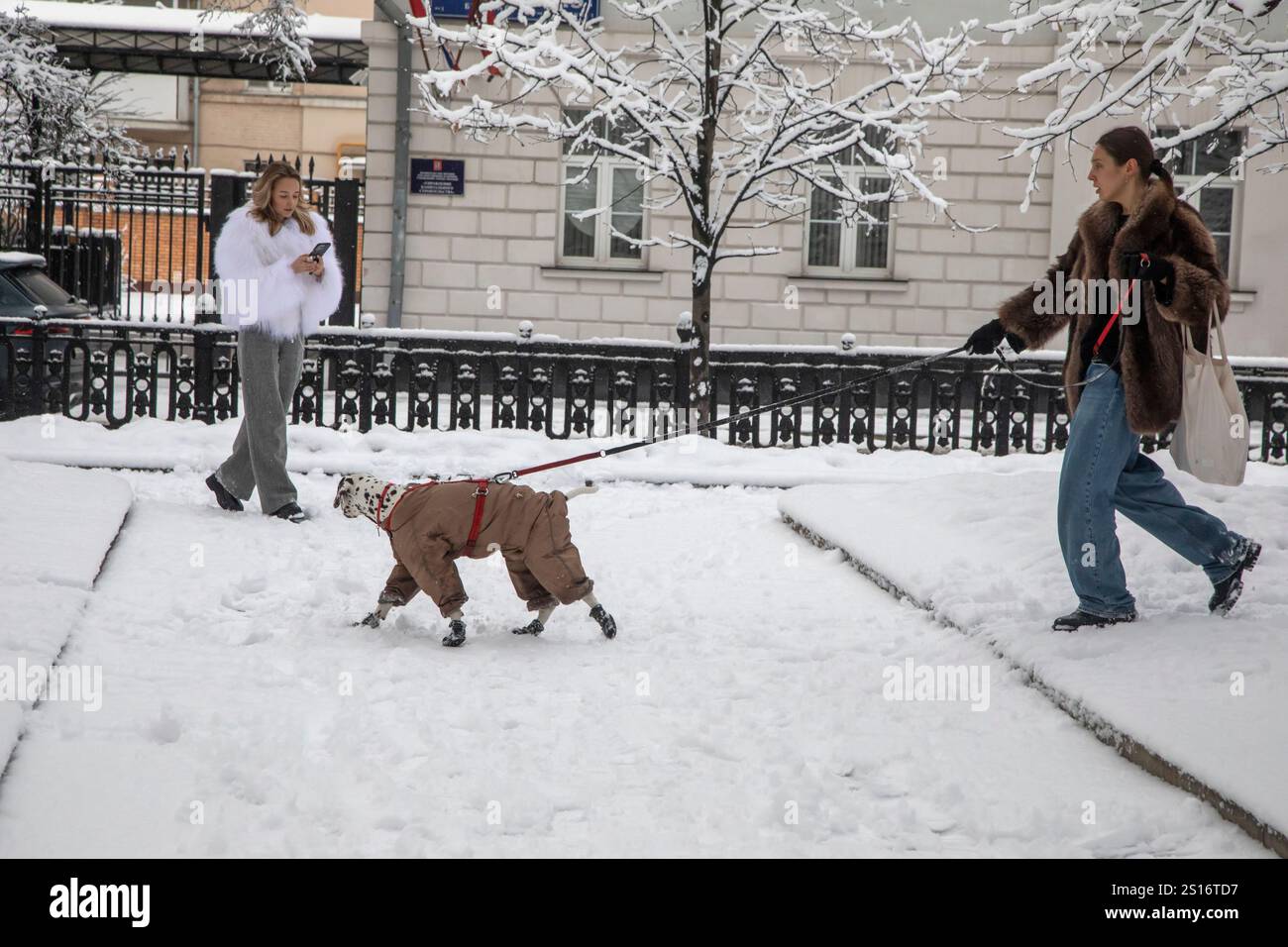 Moscow, Russia. 31st of December, 2024. Girls walk along Tverskaya ...