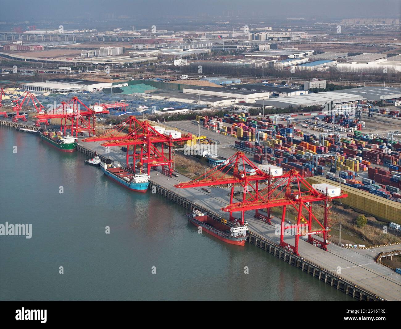 Cargo ships dock at the Longtan Container Terminal of Nanjing Port in ...