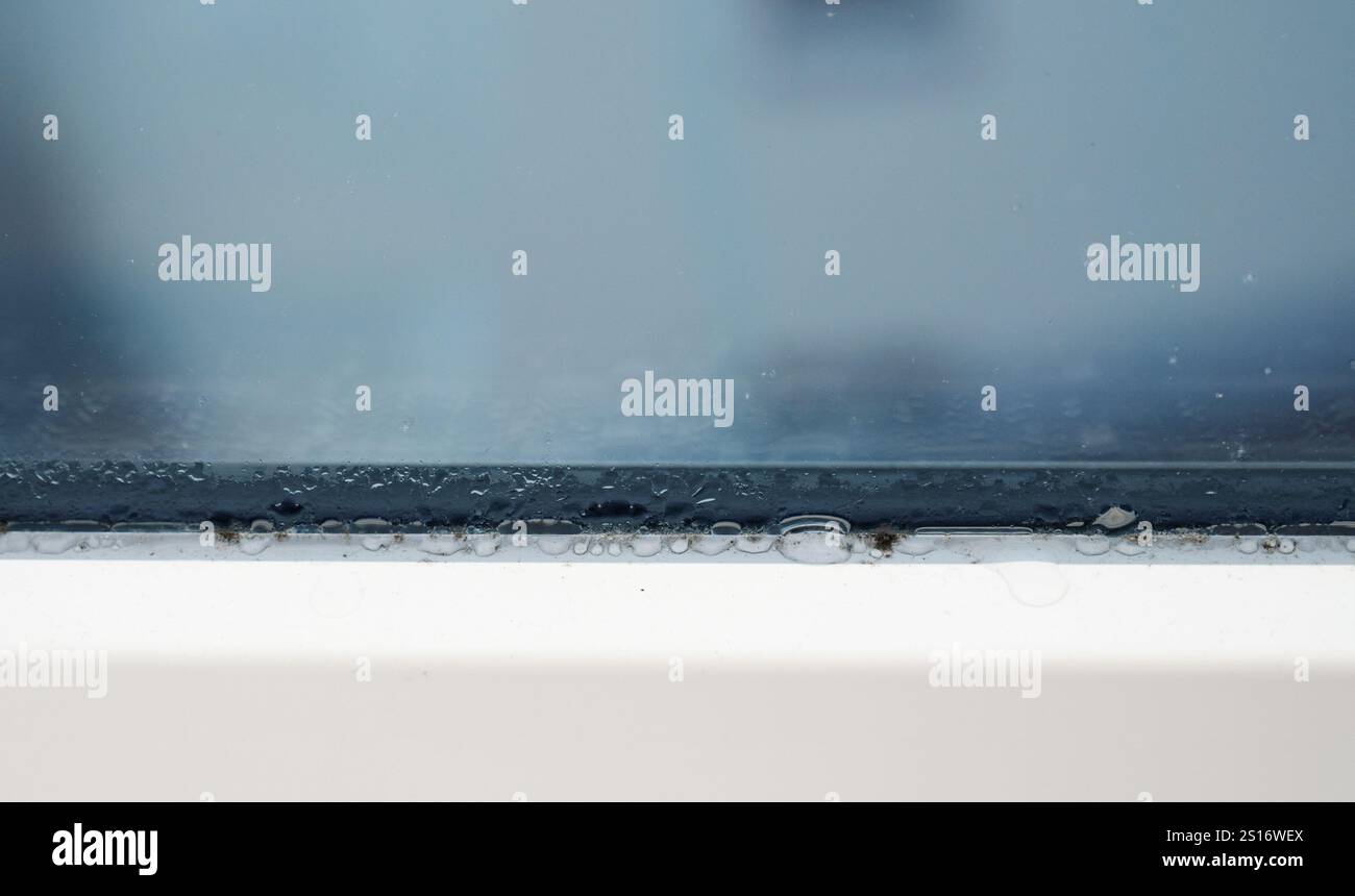 Water condensation on window glass, humidity, moisture and mold, spot ...