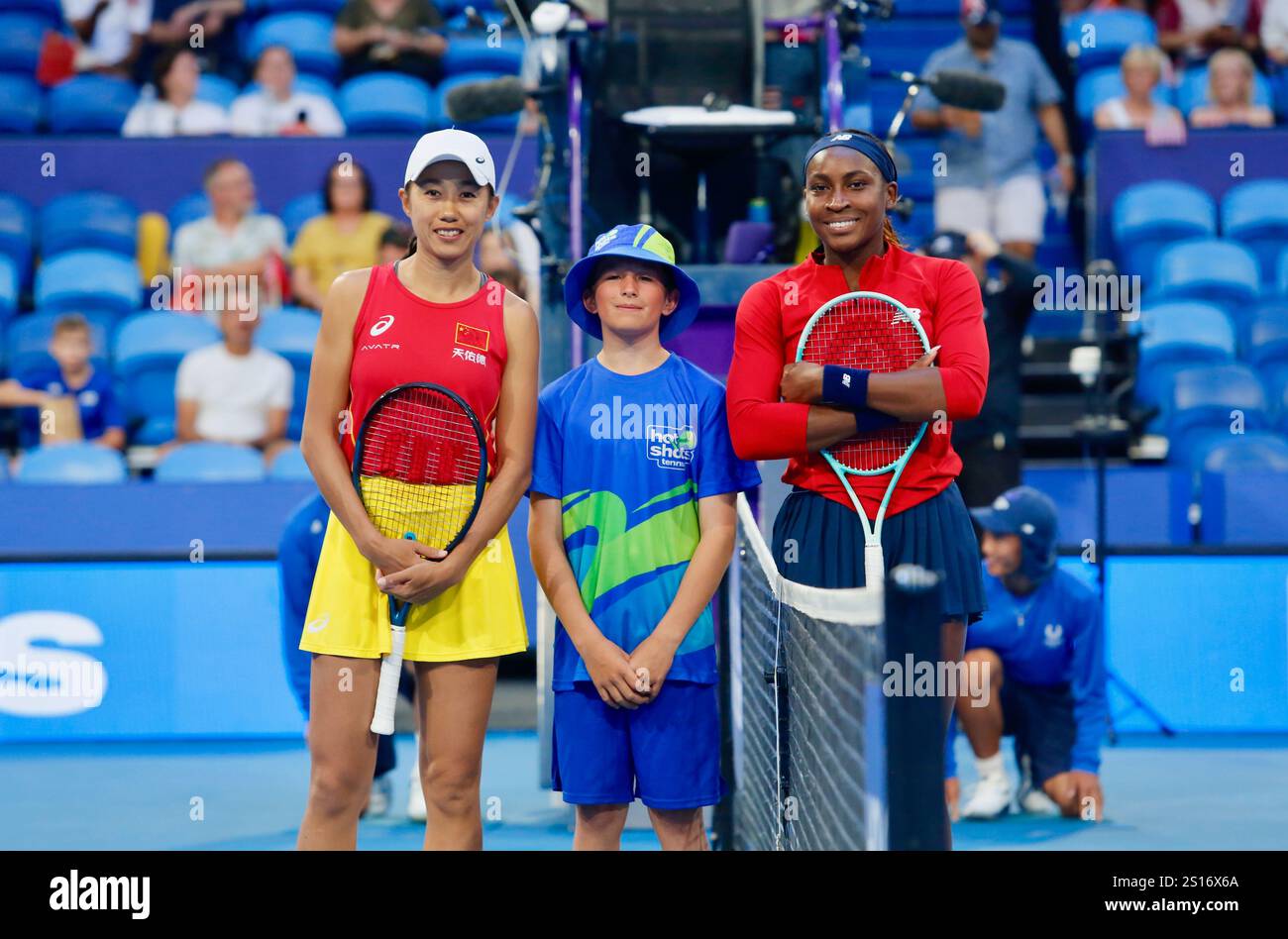 Perth, Australia. 1st Jan, 2025. Zhang Shuai (L) of China and Coco ...