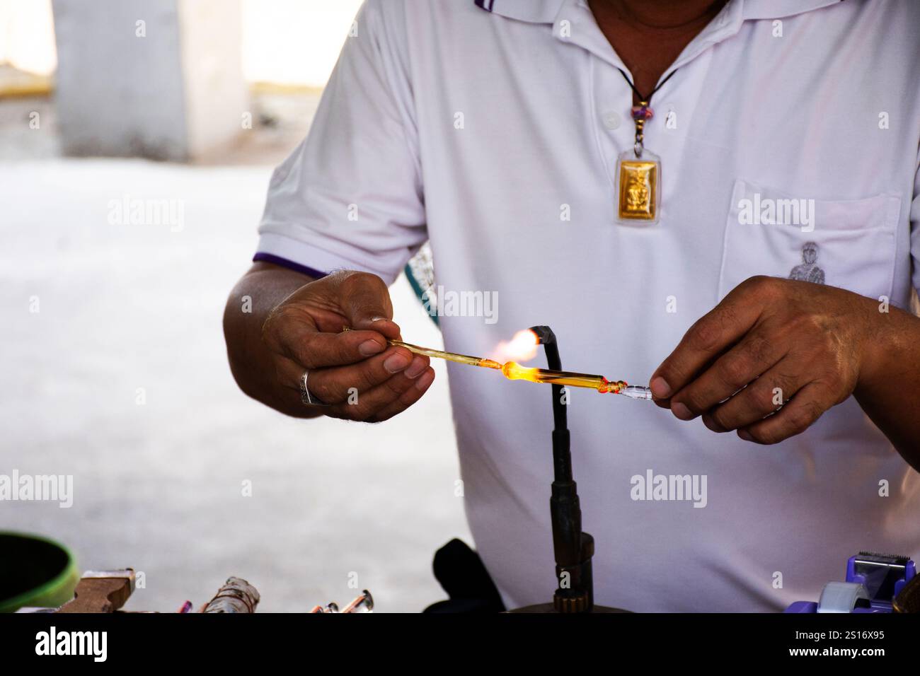 Thai craftsmanship glassmith and artist working making blown glass and ...