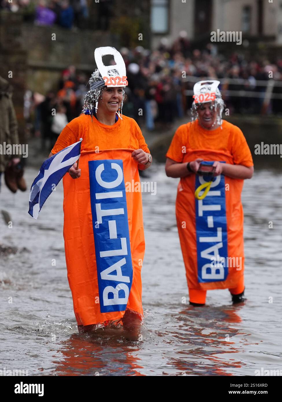 People take part in the Loony Dook New Year's Day dip in the Firth of ...