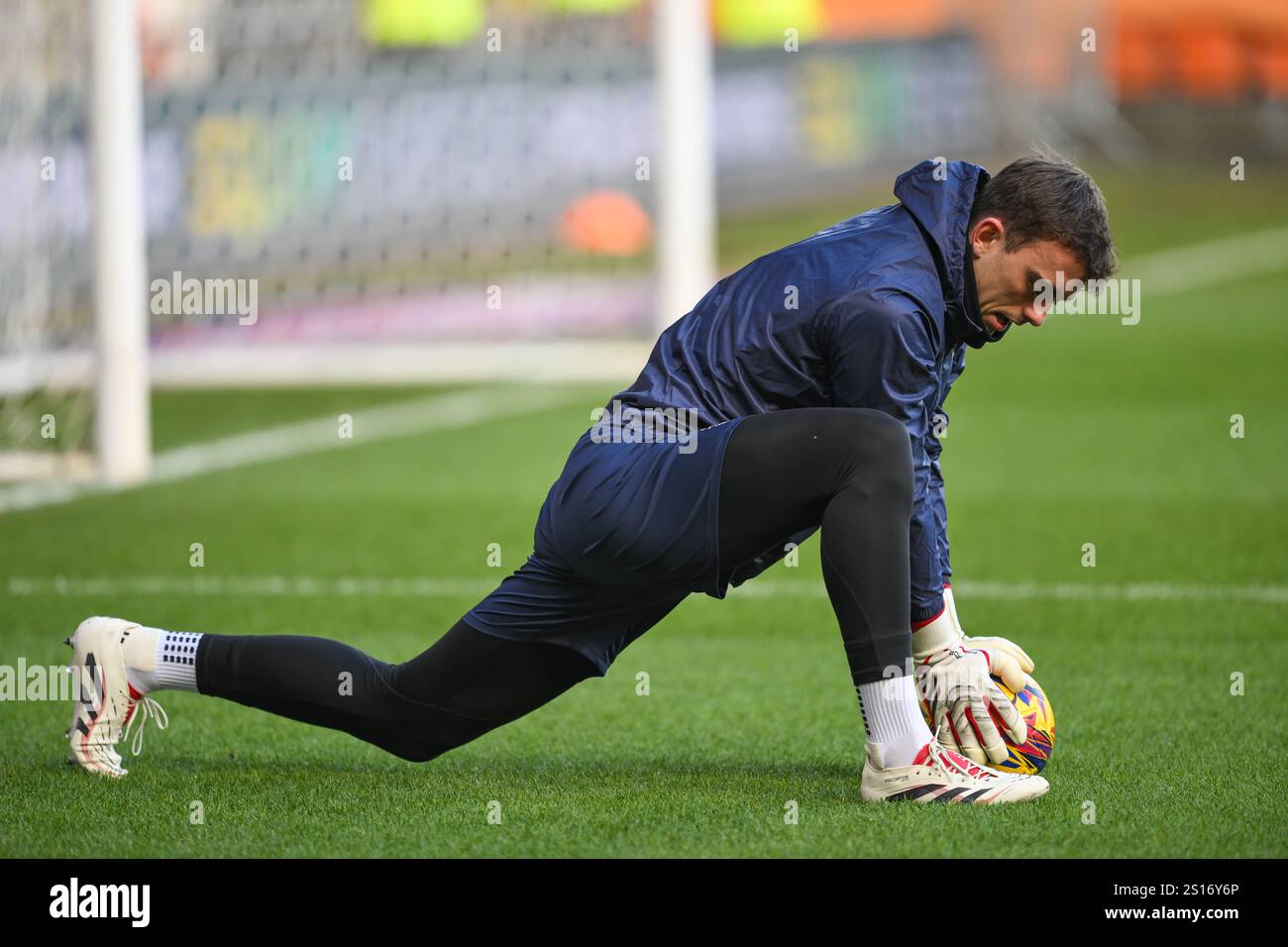 Harry Tyrer of Blackpool stretches during the pre-game warmup ahead of ...