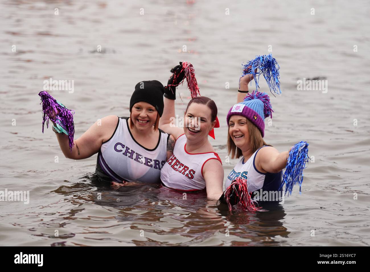 People take part in the Loony Dook New Year's Day dip in the Firth of ...