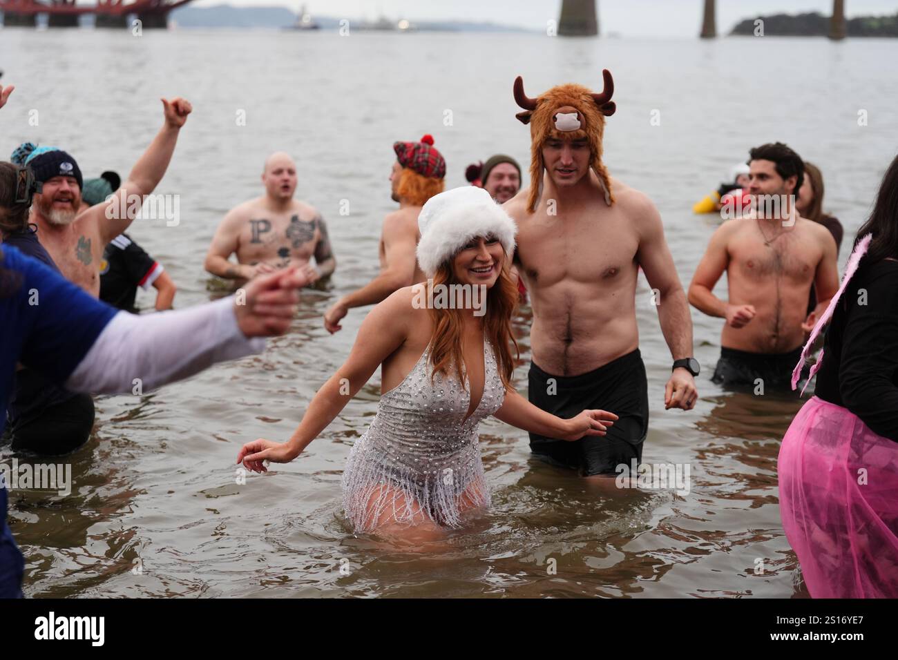 People take part in the Loony Dook New Year's Day dip in the Firth of Forth at South Queensferry ...