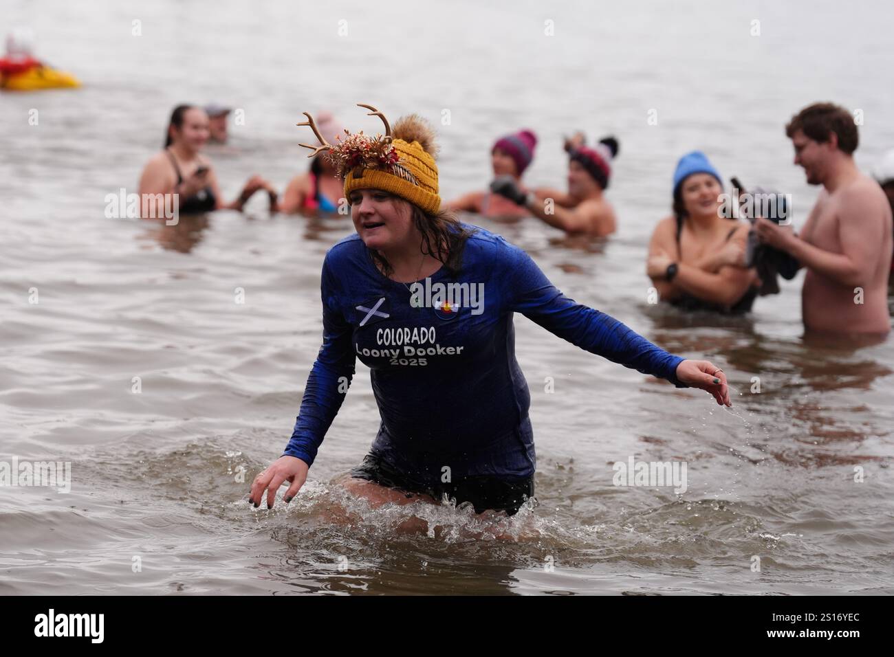 People take part in the Loony Dook New Year's Day dip in the Firth of ...
