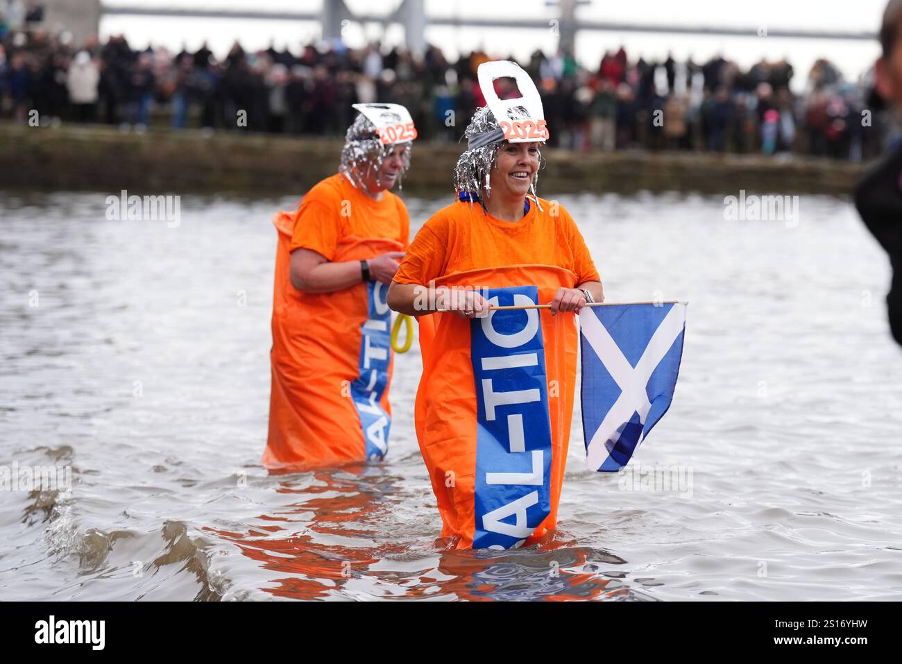 People take part in the Loony Dook New Year's Day dip in the Firth of ...