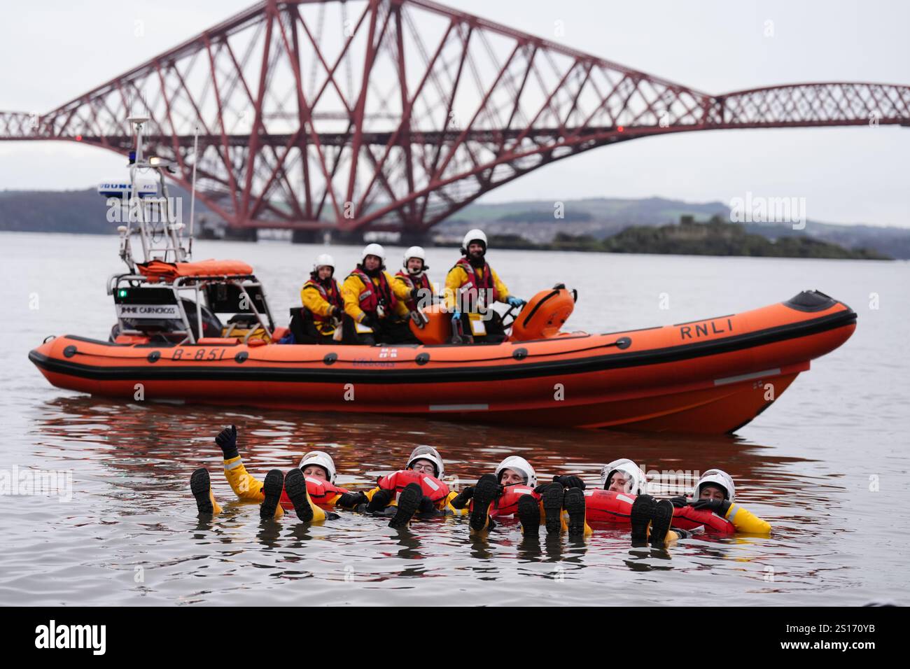 People take part in the Loony Dook New Year's Day dip in the Firth of ...
