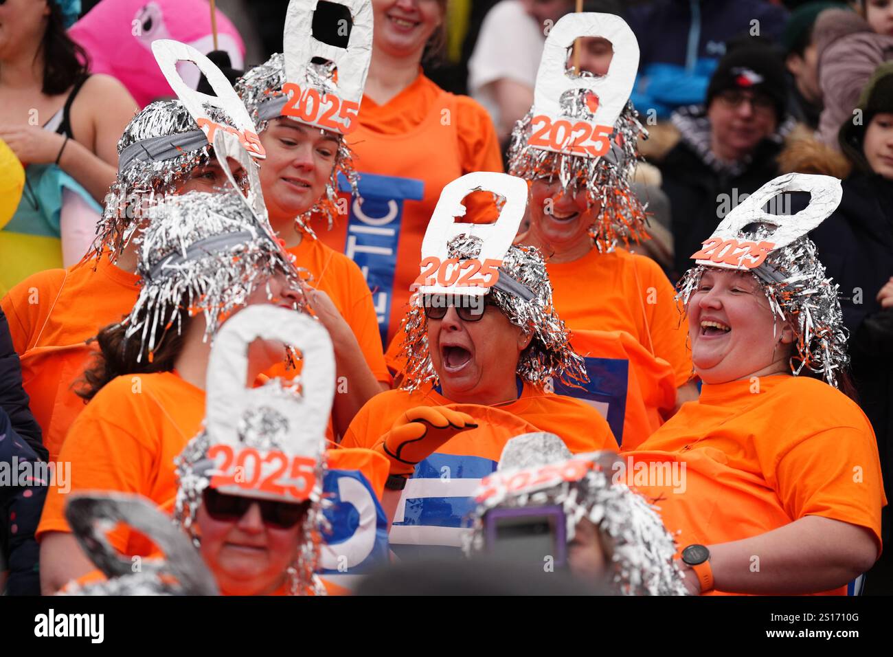 People take part in the Loony Dook New Year's Day dip in the Firth of ...