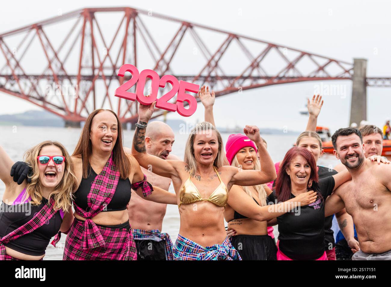 South Queensferry, Scotland, 01.01.2025 People take part in the annual "Loony Dook" to celebrate ...