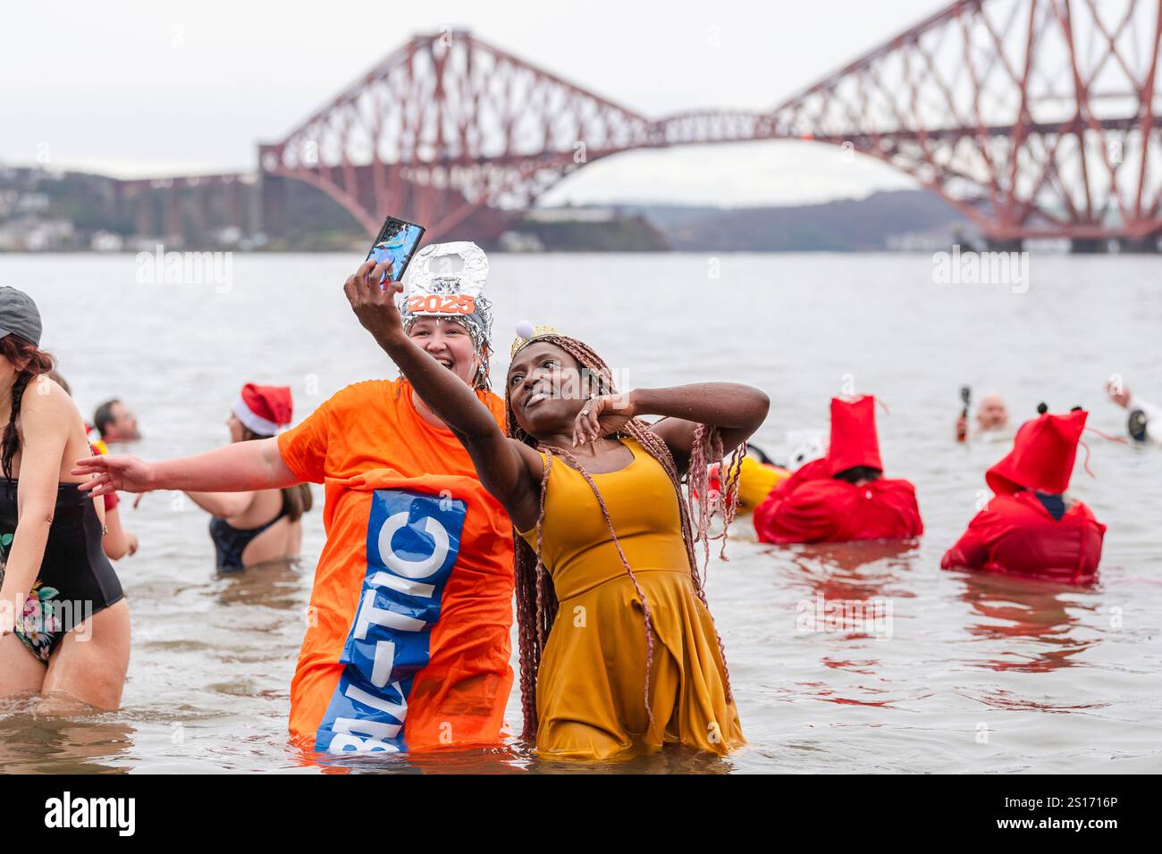 South Queensferry, UK. 01st Jan, 2025. People take part in the annual ...